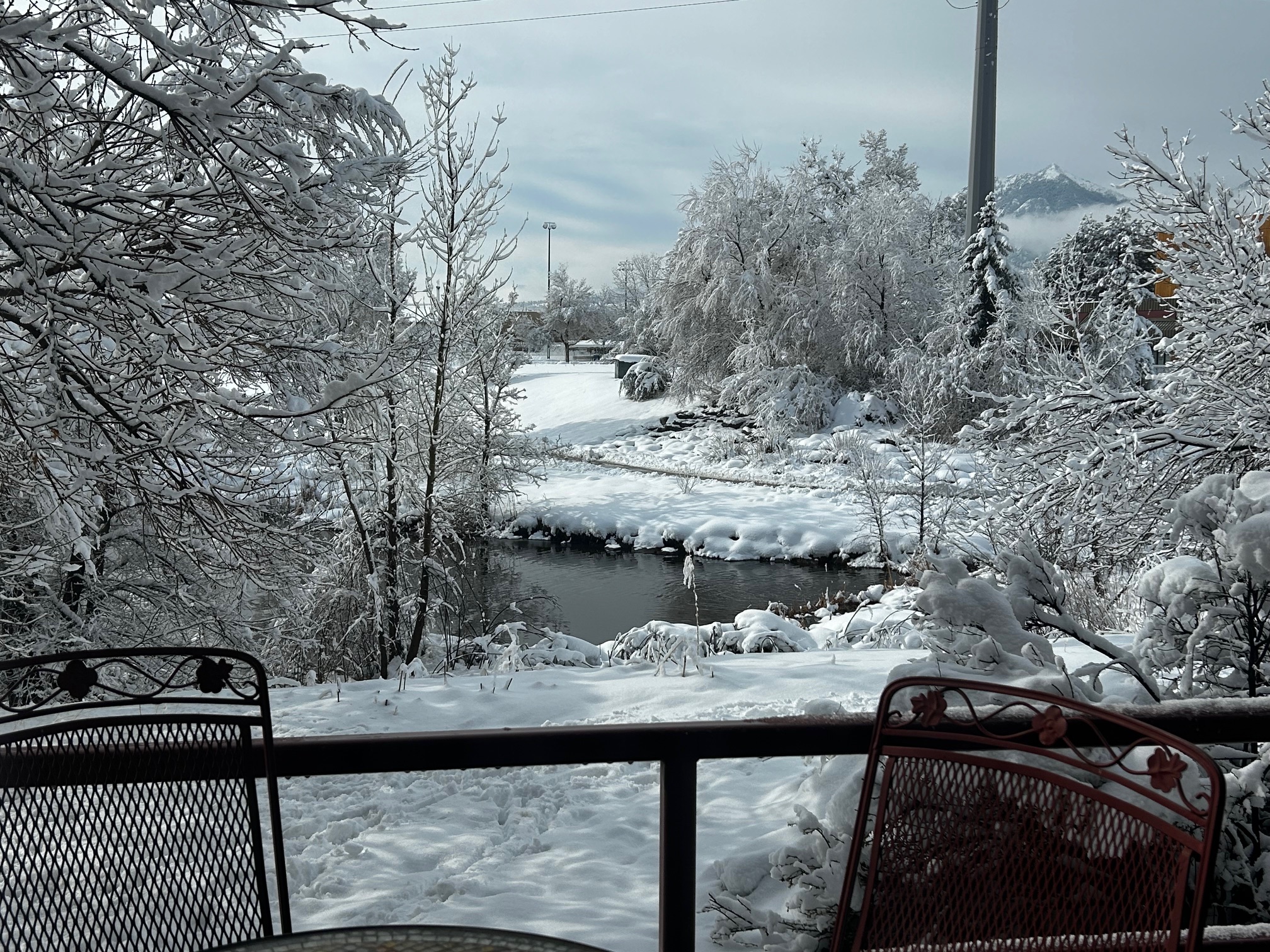 Snowy outside view from patio looking at lake.JPG | City of Boulder